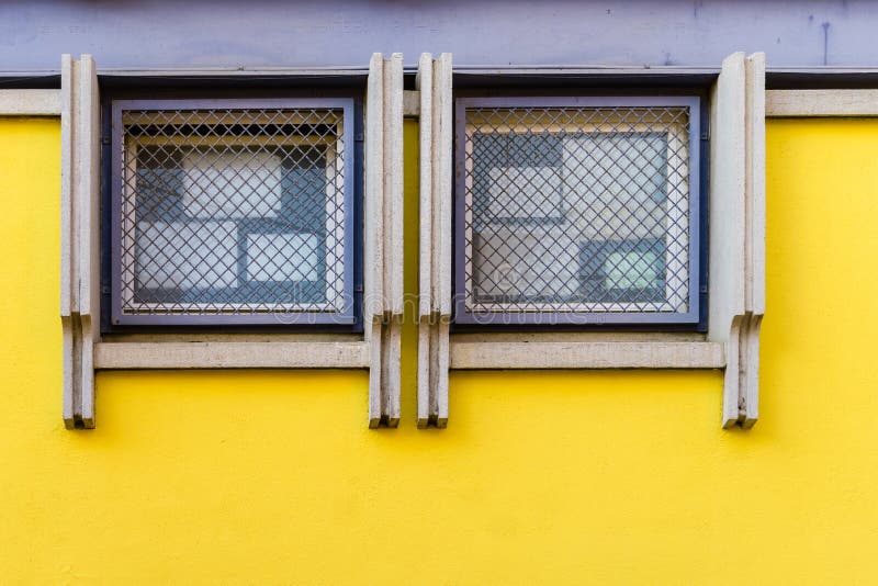 Wall of a Yellow Building with Two Square Sales Stock Photo - Image of ...