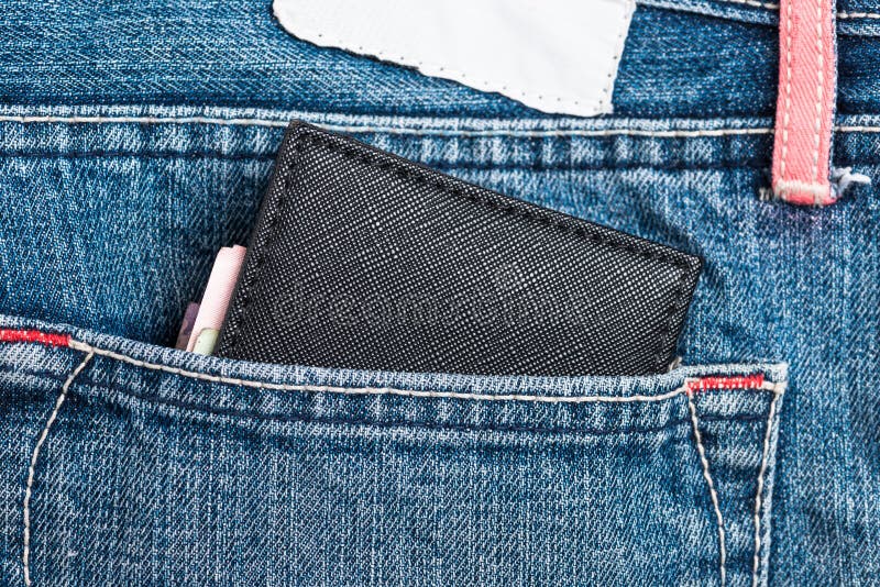 Wallet on blue jean pocket stock photo. Image of payment - 96853888