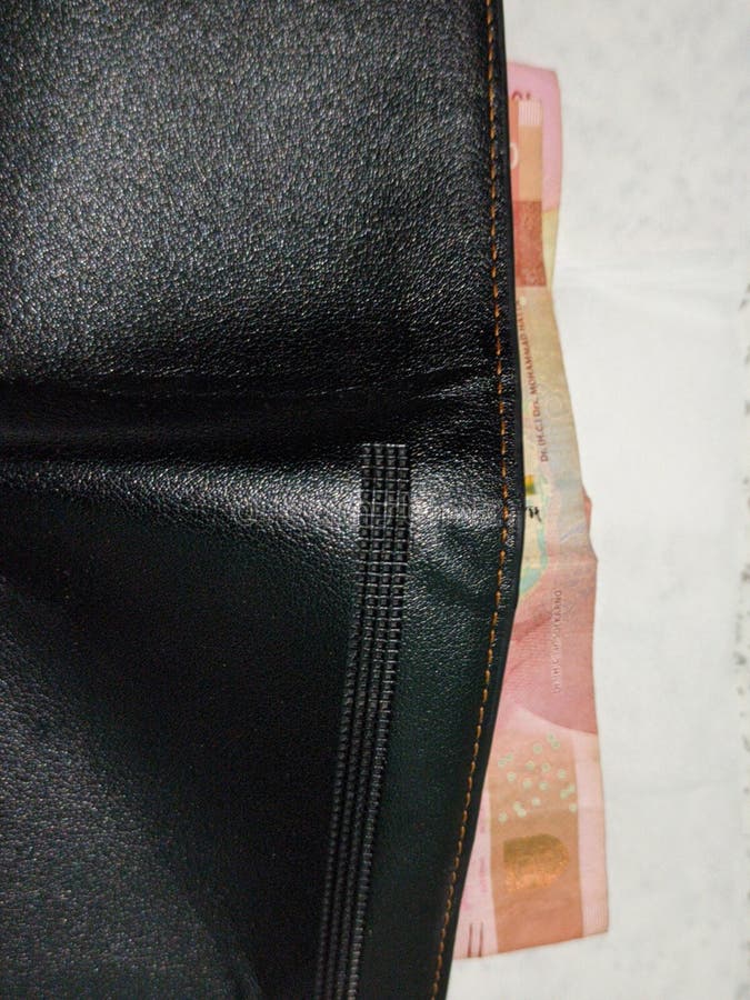 Wallet and 2 rupiah bills stock photo. Image of indonesian - 251040260