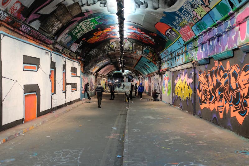 Graffiti-covered Tunnel with a Curved Ceiling, Vibrant Artwork on Both ...