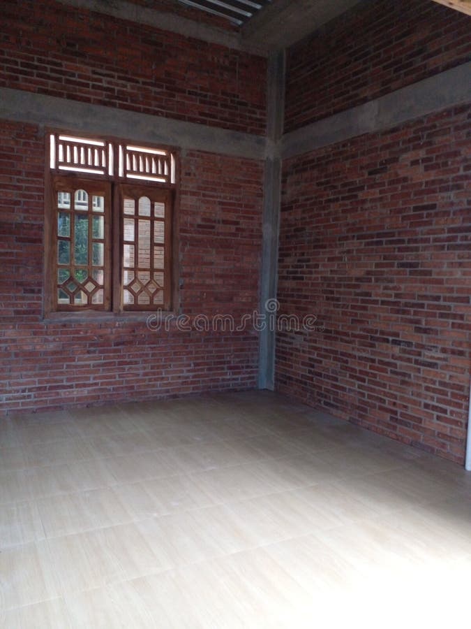 The Walls of the House are Made of Red Brick Which Gives a Unique and ...