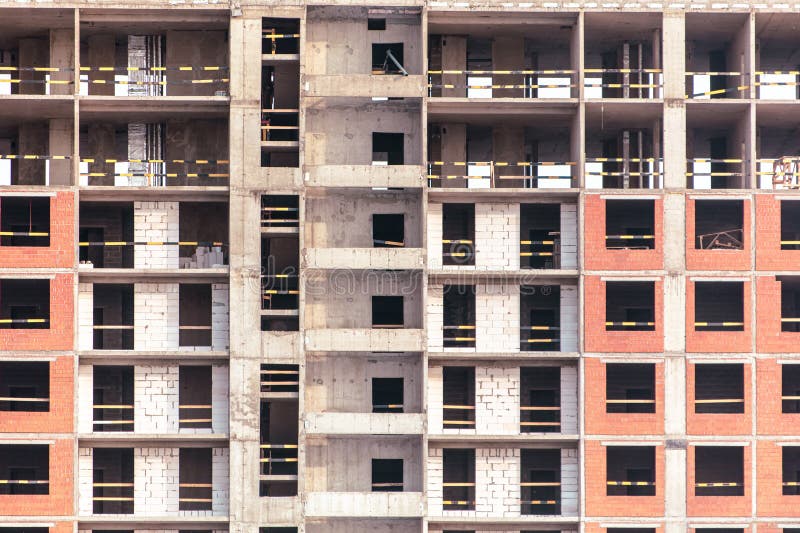The Walls of a Multi-story Building Under Construction As a Background ...