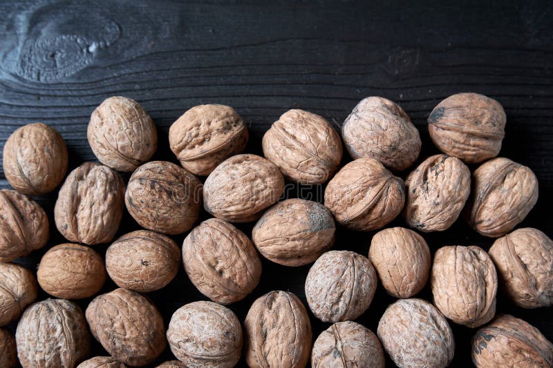 Walnut on a Black Wooden Background Still Life, Walnut Stock Image ...