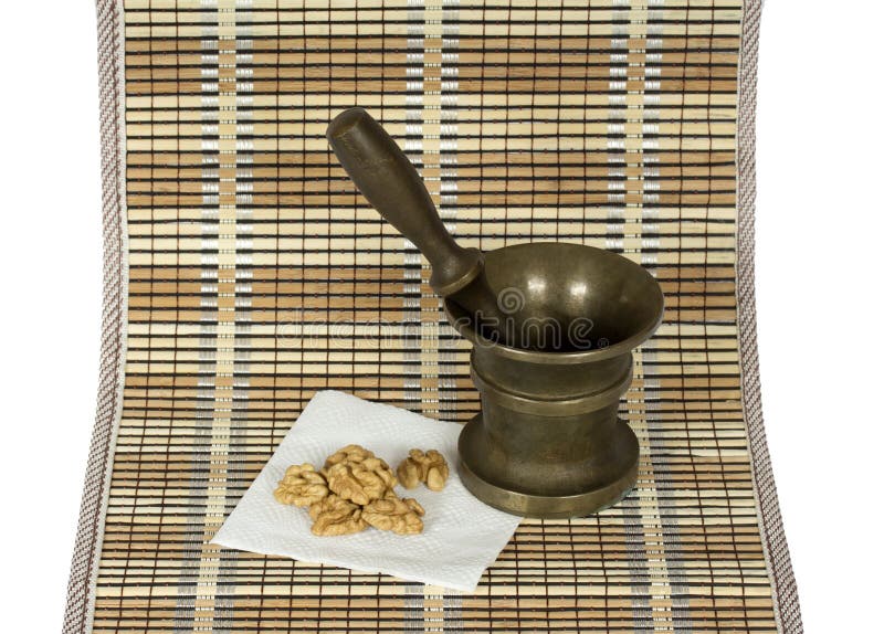 Walnut and the Copper Pounder (mortar) on the Matting Stock Image ...