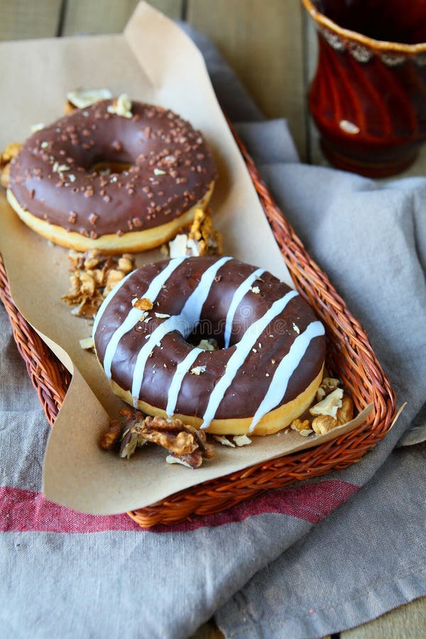 Walnut Donuts with Chocolate Frosting Stock Photo - Image of round ...