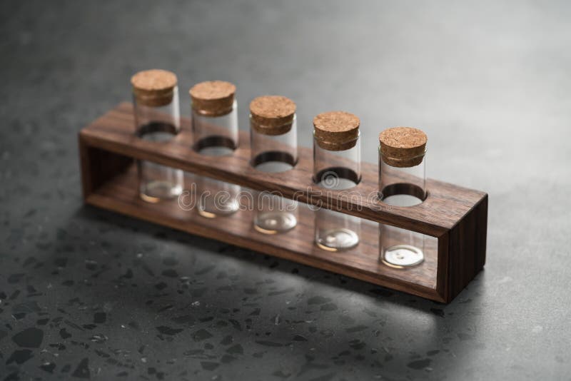 Walnut Holder with Glass Tubes for Spices on Concrete Surface Stock ...