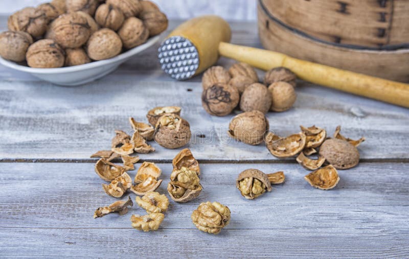 Walnut Kernels and Whole Walnuts on the Rustic Grunge Table Stock Photo ...