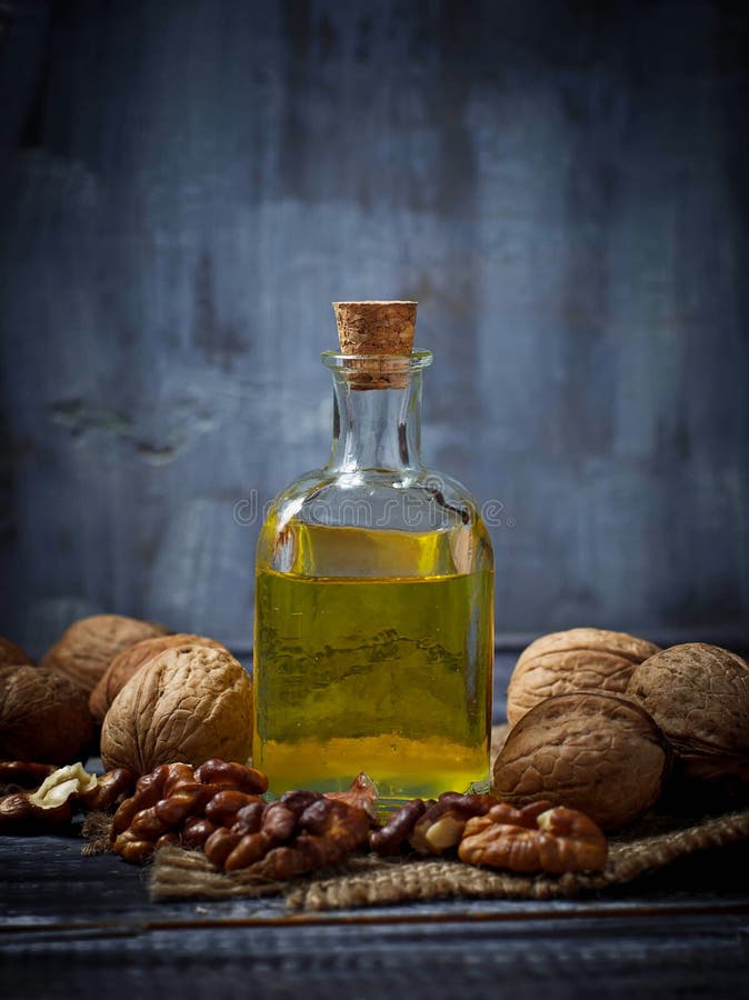Walnut Oil in Bottle and Nuts Stock Image - Image of bottle, healing ...