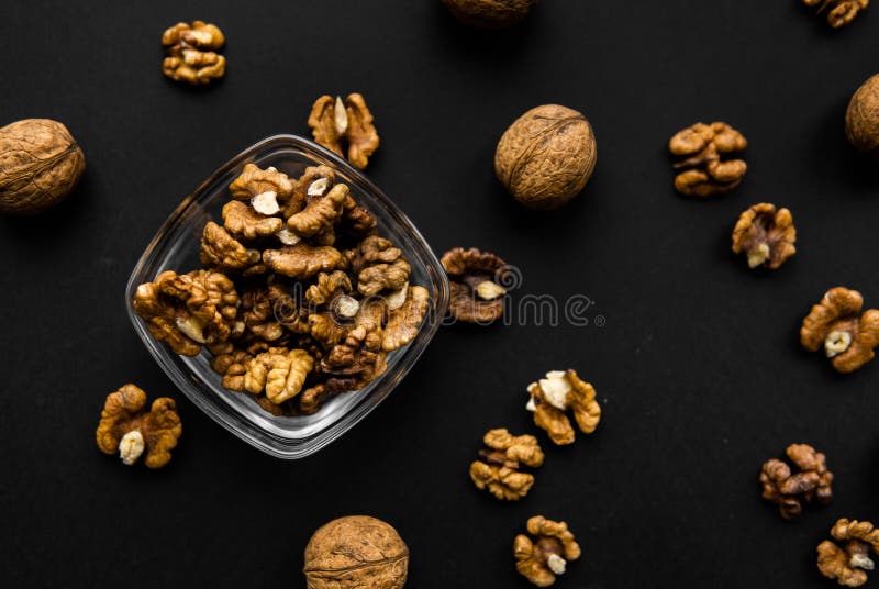 Walnut in a Small Plate with Scattered Shelled Nuts Which Standing on a ...