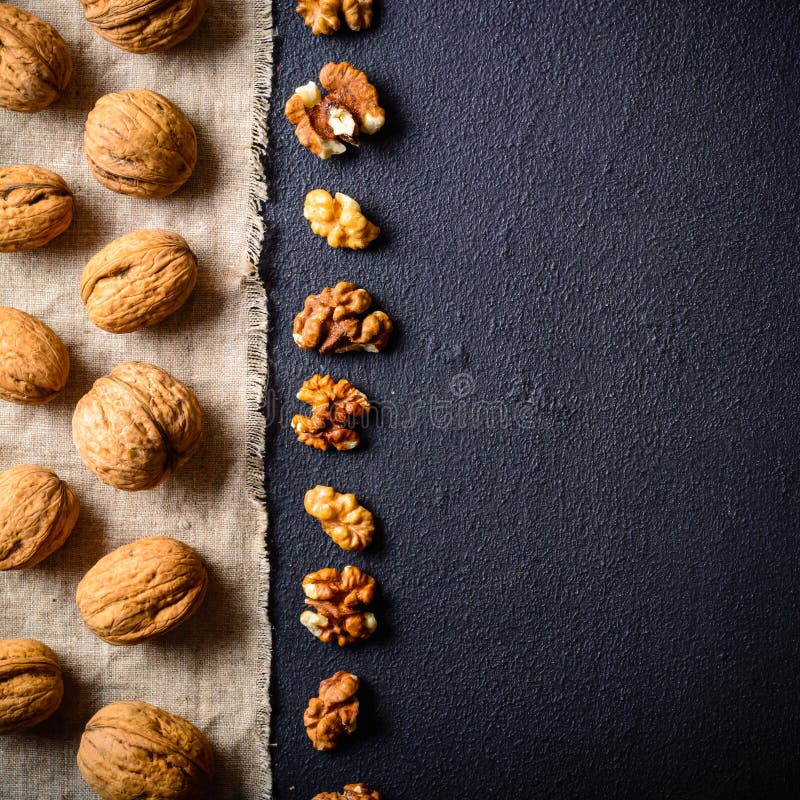 Walnuts on a Black Slate. Whole and Peeled Nuts. Walnuts Spread Out ...