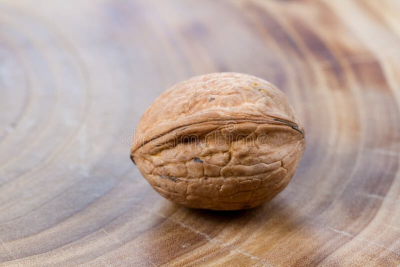Walnuts Close-up on a Table from a Cut of a Poplar Trunk, Growth Rings ...