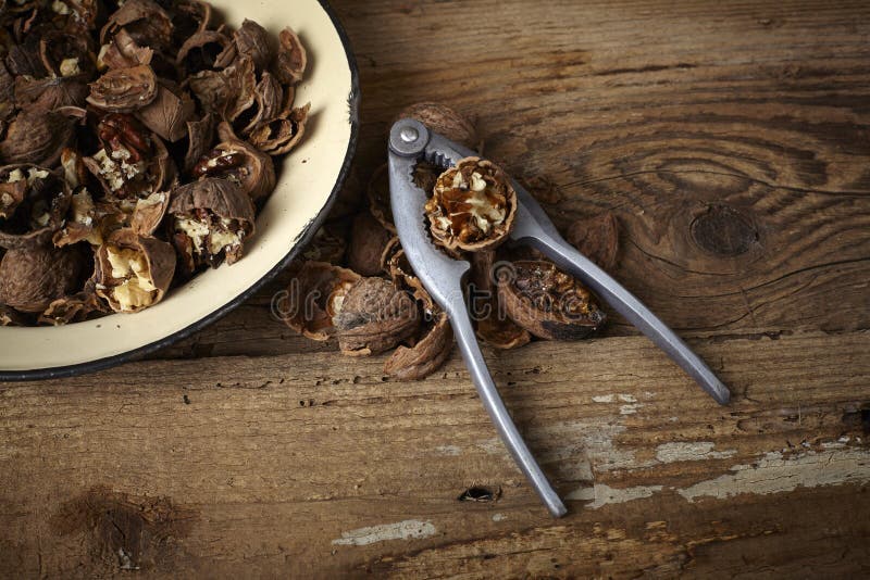 Walnuts Cracked Open with Old Nut Cracker in a Vintage Plate on Stock ...