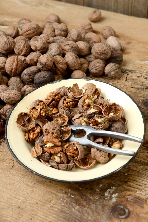 Walnuts Cracked Open with a Wooden Nut Cracker Stock Photo - Image of ...