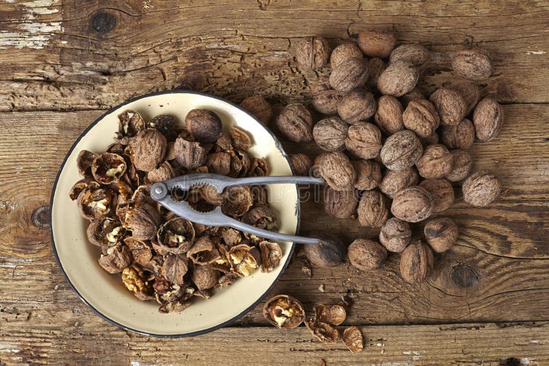 Walnuts Cracked Open with Old Nut Cracker in a Vintage Plate on Stock ...