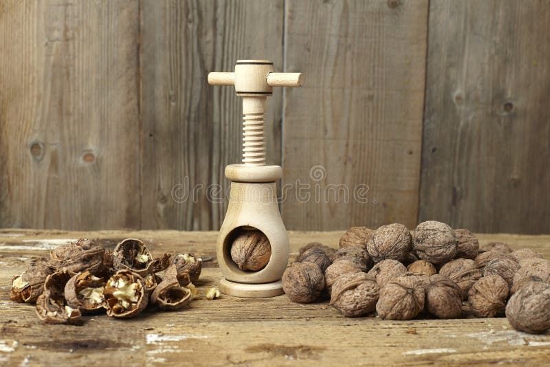 Walnuts Cracked Open with a Wooden Nut Cracker Stock Image - Image of ...