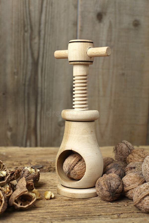 Walnuts Cracked Open with a Wooden Nut Cracker Stock Photo - Image of ...