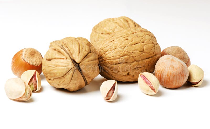 Walnuts, Hazelnuts and Pistachios on a White Background. Nut - a Source ...