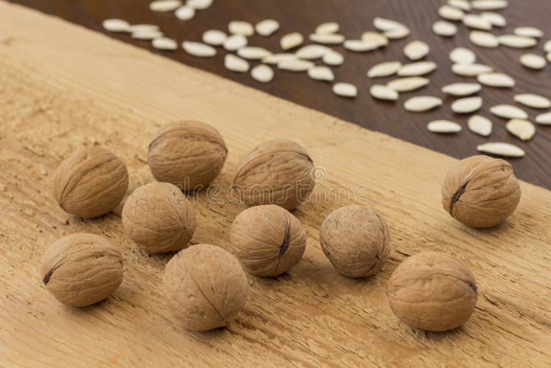Walnuts on a Light Board and Pumpkin Seeds on a Dark Table. Low Calorie ...
