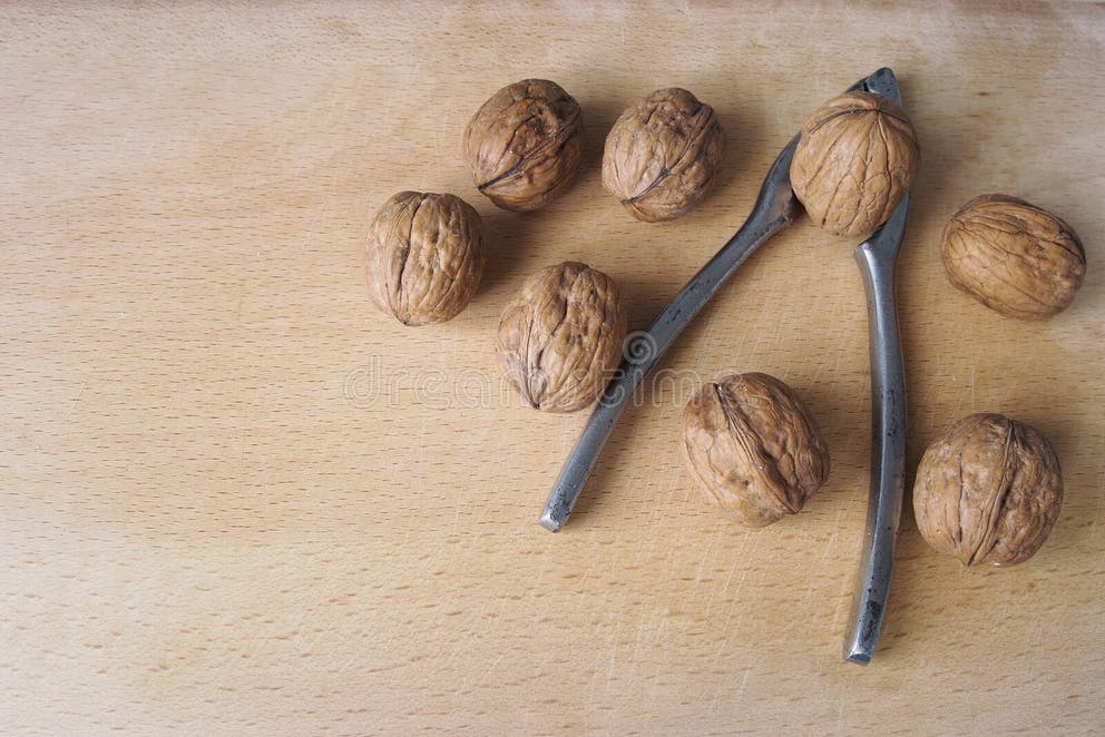 Walnuts and nutcracker. stock photo. Image of horizontal - 55057242
