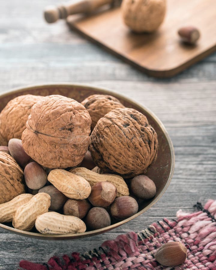Walnuts, Peanuts, Hazelnuts on a Vintage Plate Stock Image - Image of ...