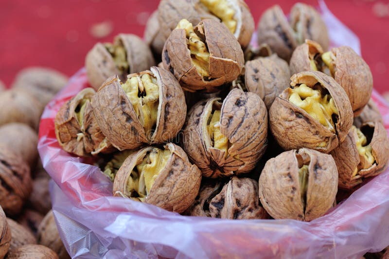 Walnuts for Sale in Yellow Open Woven Bags. Stock Image - Image of ...