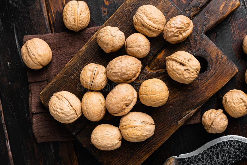 Walnuts with Shells, on Old Dark Wooden Table Background, Top View Flat ...