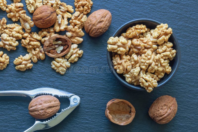 Walnuts and Nutcracker on Dark Table Stock Photo - Image of vegan ...