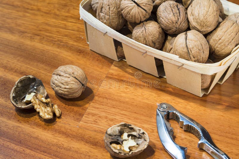 Walnuts in Wicker Basket with Nutcracker Stock Photo - Image of healthy ...