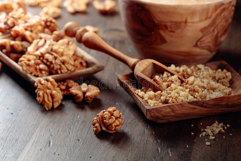 Walnuts in a Wooden Dish on an Old Wooden Table Stock Image - Image of ...