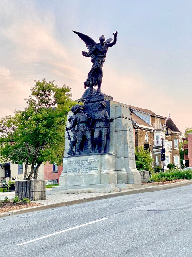 War Memorial Statue with a Winged Figure and Soldiers in a Small Town ...