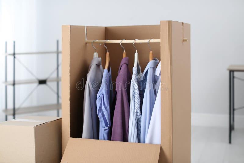 Wardrobe Box with Clothes on Hangers Stock Image - Image of hanging ...