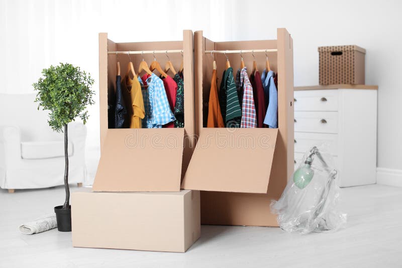 Wardrobe Boxes with Clothes in Room Stock Image - Image of interior ...
