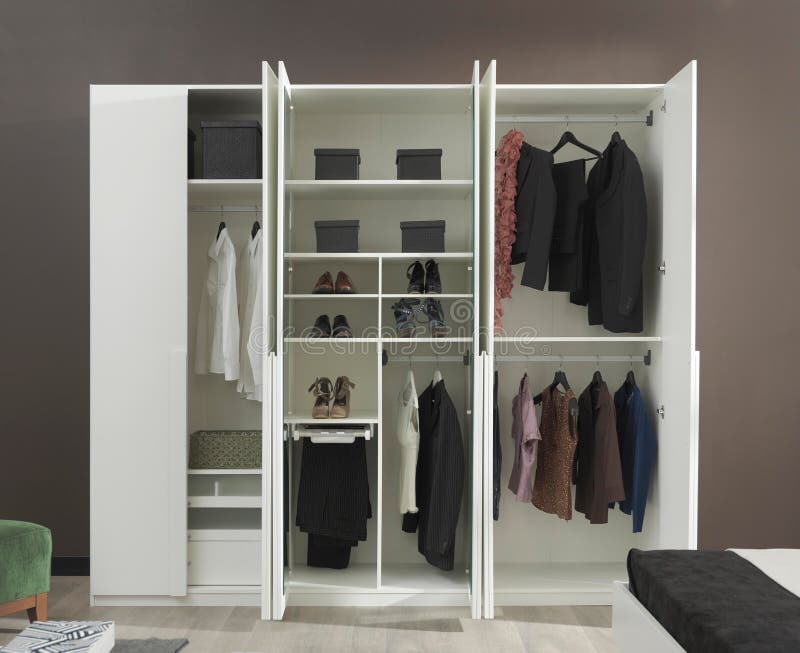 Wardrobe Full of Colorful Hanged and Folded Clothes Stock Photo - Image ...