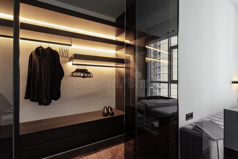 Wardrobe in a Modern Interior, Wardrobe Clothes, Sofa and Lighting ...