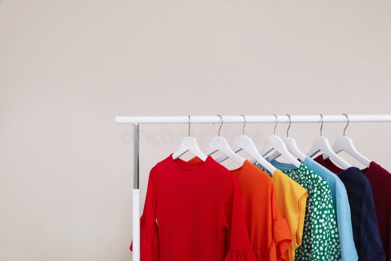 Rack with Bright Clothes on White Background Stock Image - Image of ...
