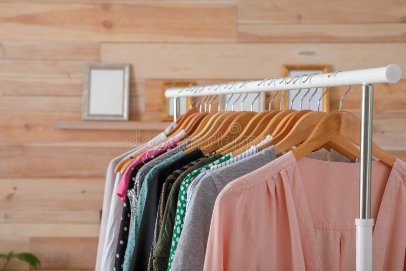 Wardrobe Rack with Stylish Female Clothes, Space for Text Stock Photo ...