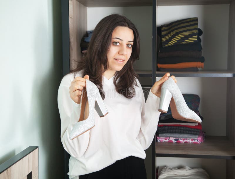 Wardrobe, Young Woman, Shoes in Hand Stock Photo - Image of hanging ...