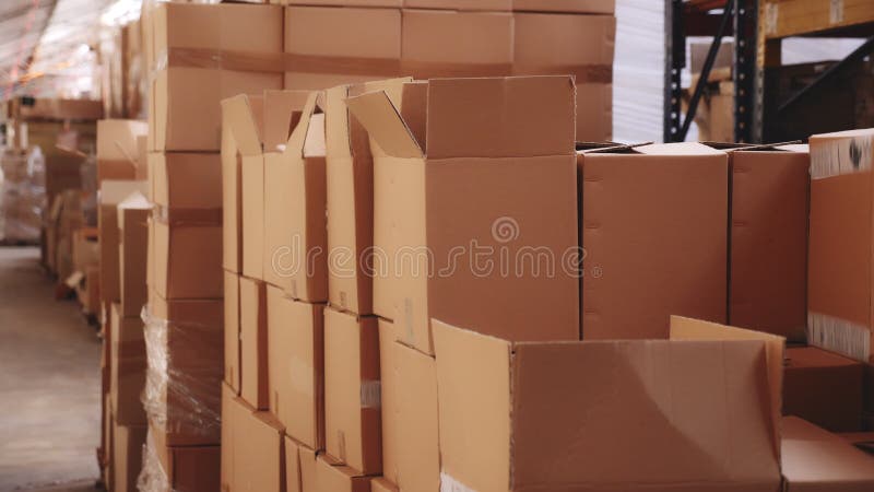 Warehouse - Boxes with Various Goods on Racks and on the Floor Stock ...