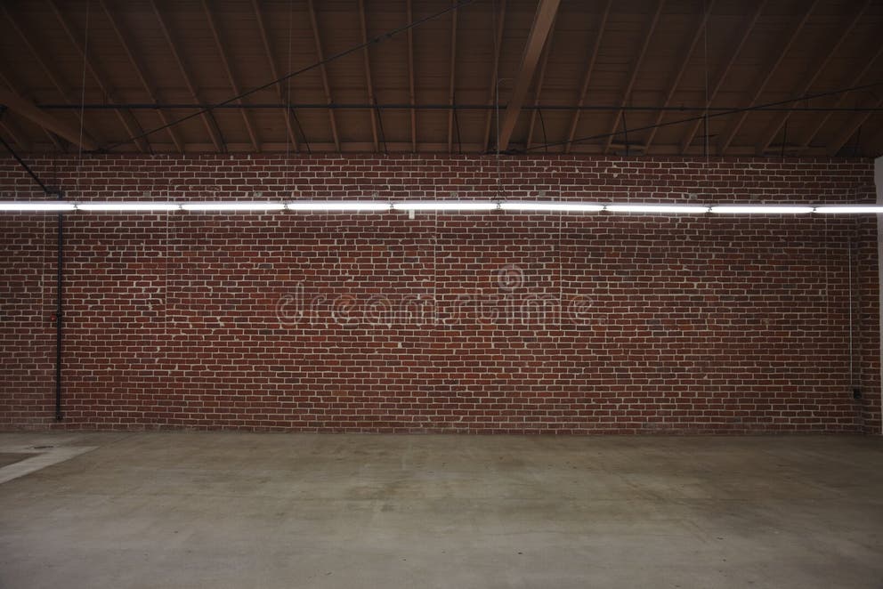 Warehouse with brick wall stock photo. Image of floor - 15147316