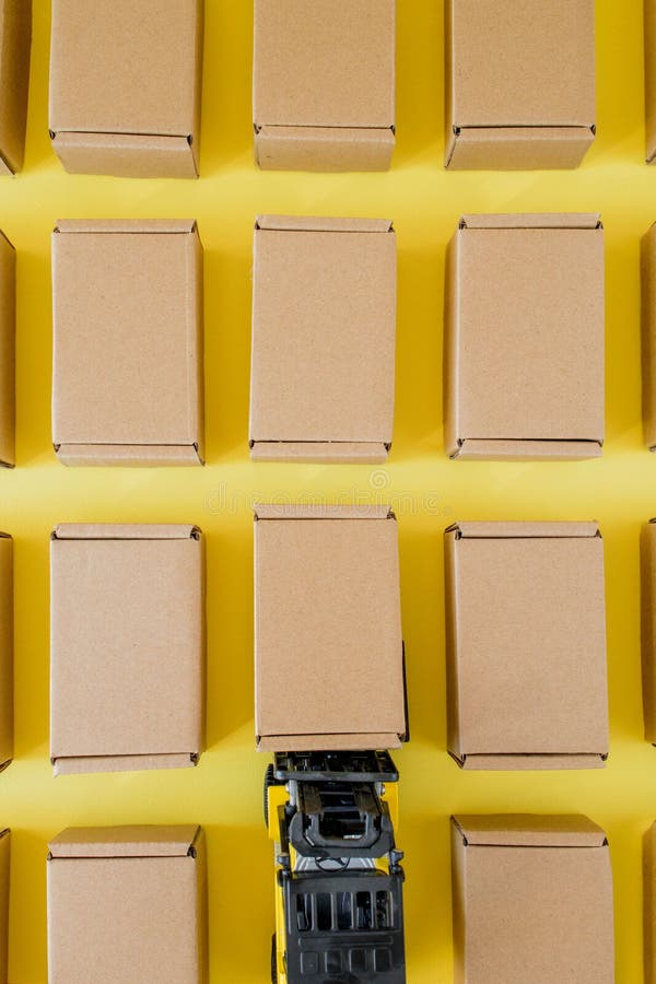 Warehouse with Cardboard Kraft Boxes and a Forklift Truck. Cargo ...