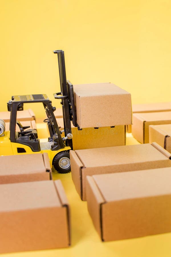 Warehouse with Cardboard Kraft Boxes and a Forklift Truck. Cargo ...