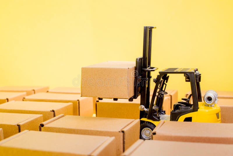 Warehouse with Cardboard Kraft Boxes and a Forklift Truck. Cargo ...