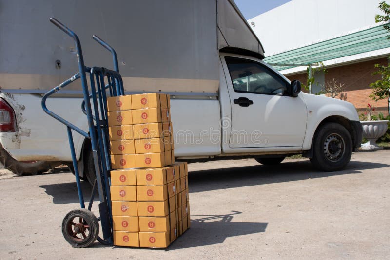Warehouse Carts with Parcel and Delivery Car Stock Photo - Image of ...