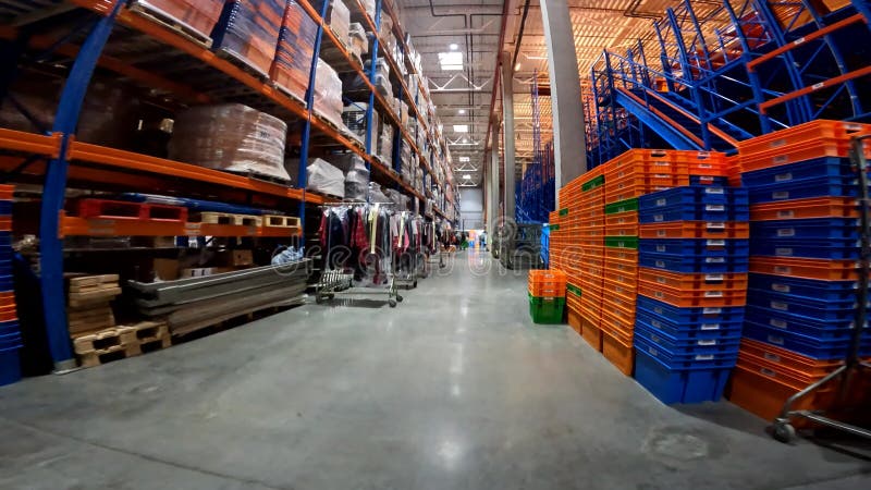 Clothes in the Warehouse of the Factory. Industrial Interior. Warehouse ...