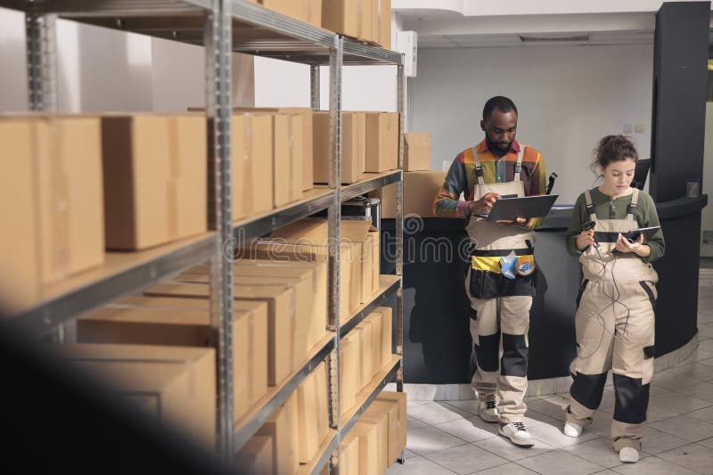 Warehouse Employee Checking Goods Logistics on Device Stock Photo ...