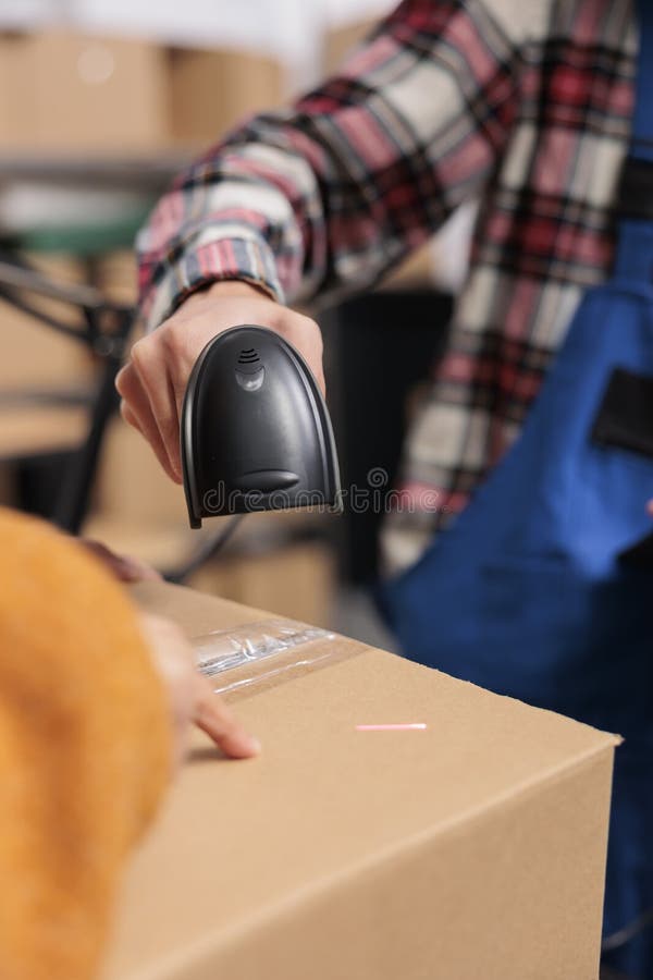 Warehouse Employee Scanning Cardboard Box while Doing Inventory Control ...