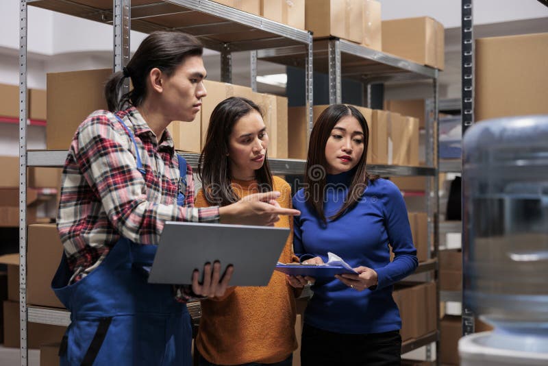 Warehouse Employees Preparing Order Using Pick Ticket on Laptop Stock ...