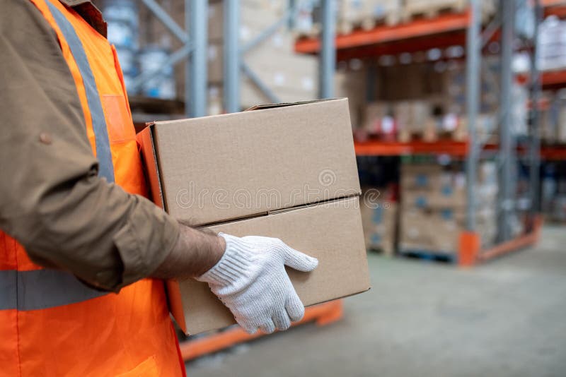 Warehouse Engineer in Workwear Carrying Boxes Stock Photo - Image of ...