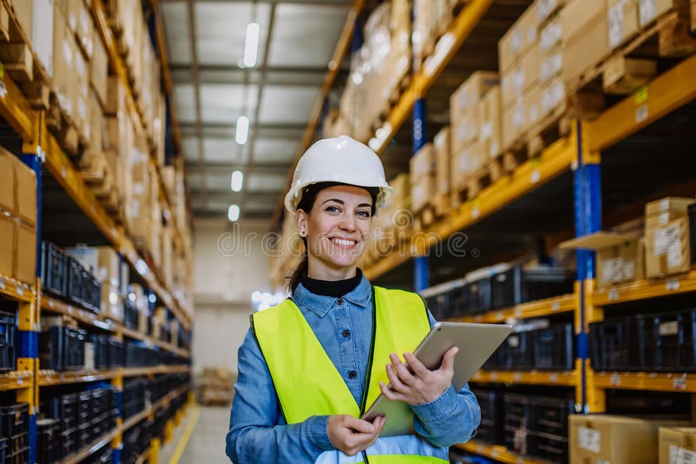 Warehouse Female Worker Checking Up Stuff in a Warehouse. Stock Photo ...