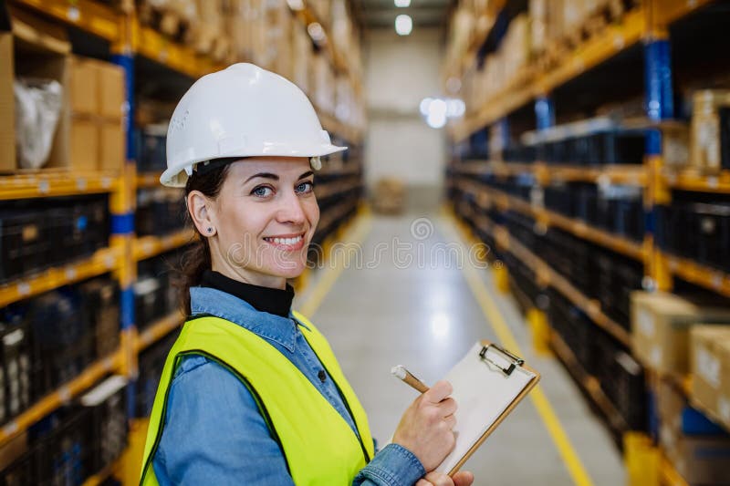 Warehouse Female Worker Checking Up Stuff in a Warehouse. Stock Image ...